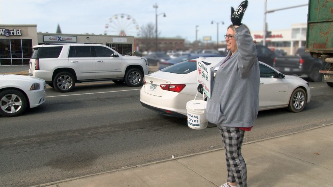 Volunteer panhandlers raise money for homeless population in Conway ...