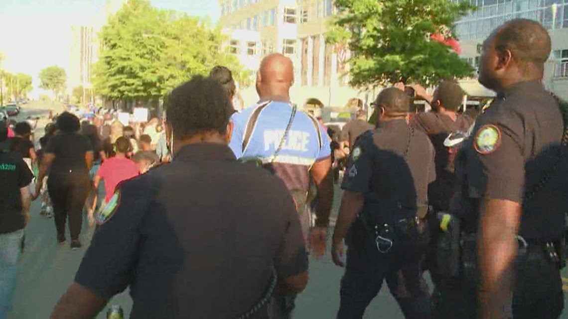 Arkansas law enforcement march with protesters at the Capitol | thv11.com