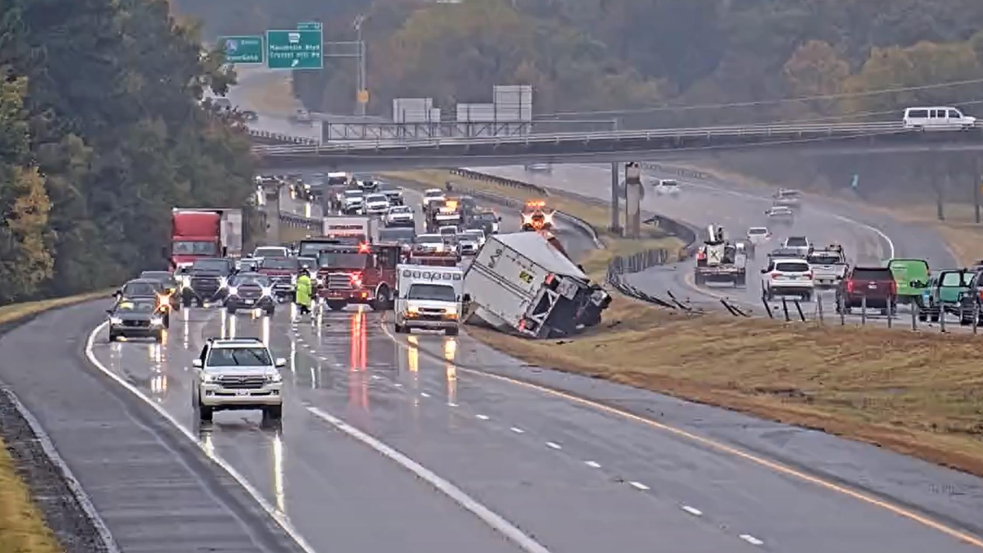 Overturned 18-wheeler leaking diesel causing traffic on I-430 near ...
